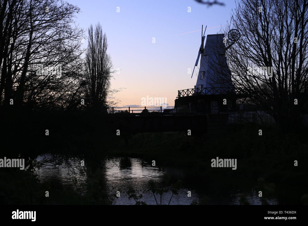 Windmill & Reflections on the water at Rye, East Sussex at sunset Stock ...