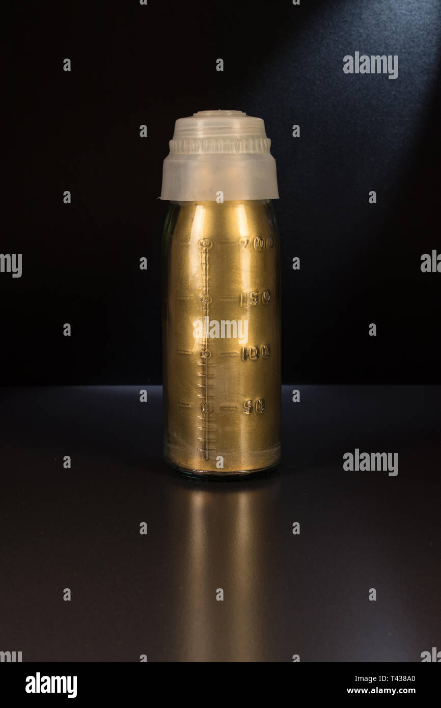 Old soviet glass bottle with measuring scale with bronze powder patina ...