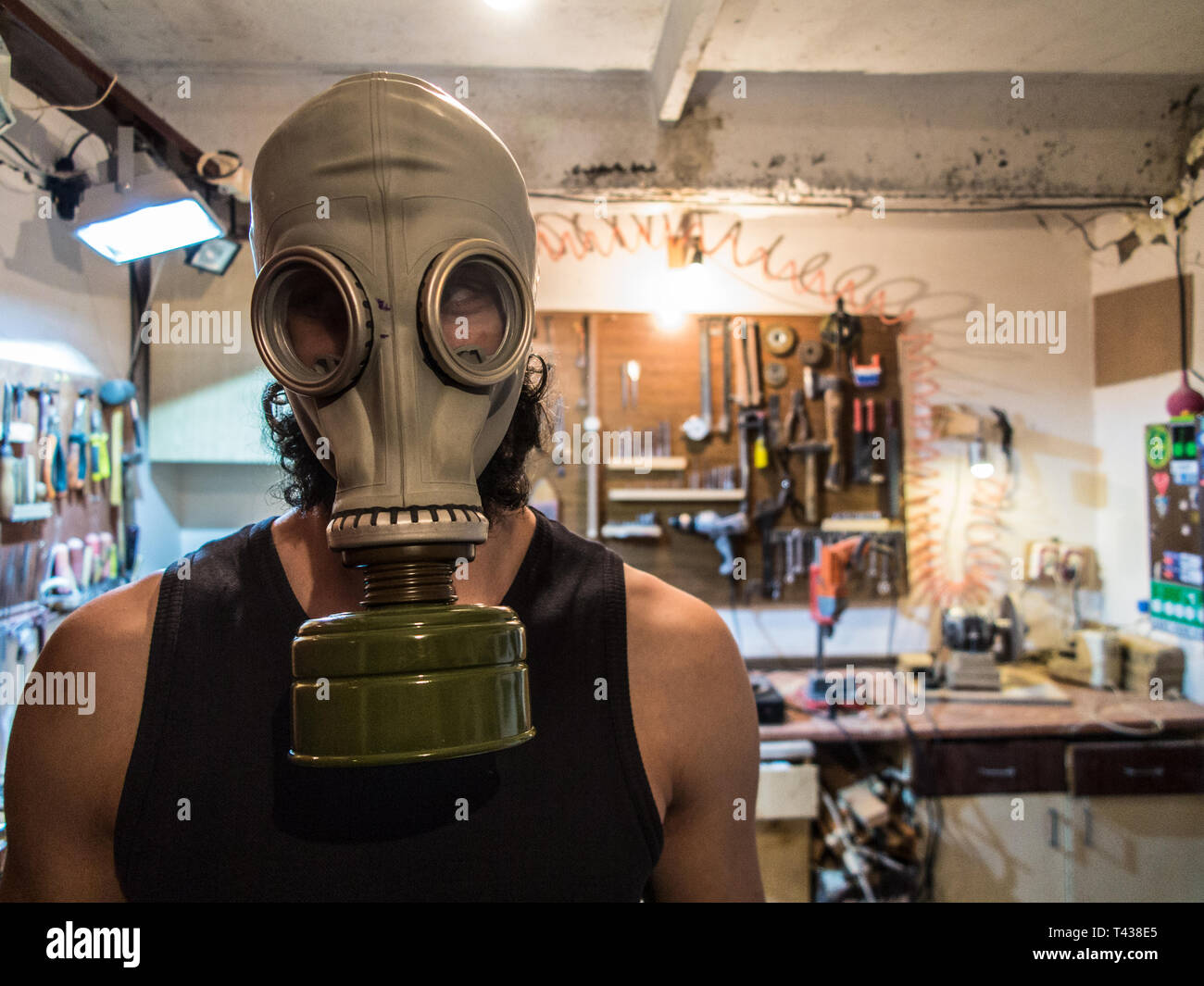 Worker in a workshop wearing soviet military respirator gas mask Stock ...