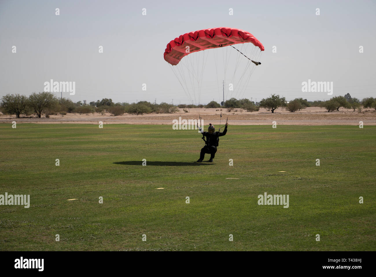 Action sports skydiving. Flying a parachute after a freefall skydive ...