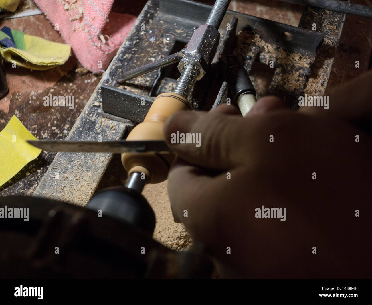 Carpenter working on self made wood lathe with chisel Stock Photo - Alamy