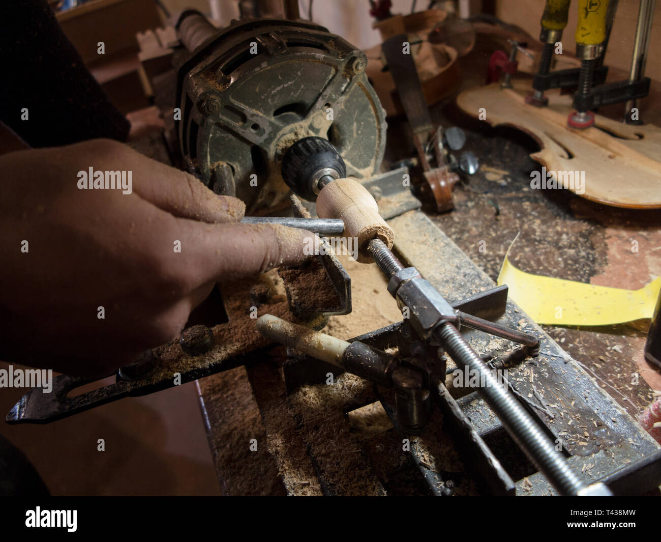 Carpenter working on self made wood lathe with chisel Stock Photo - Alamy