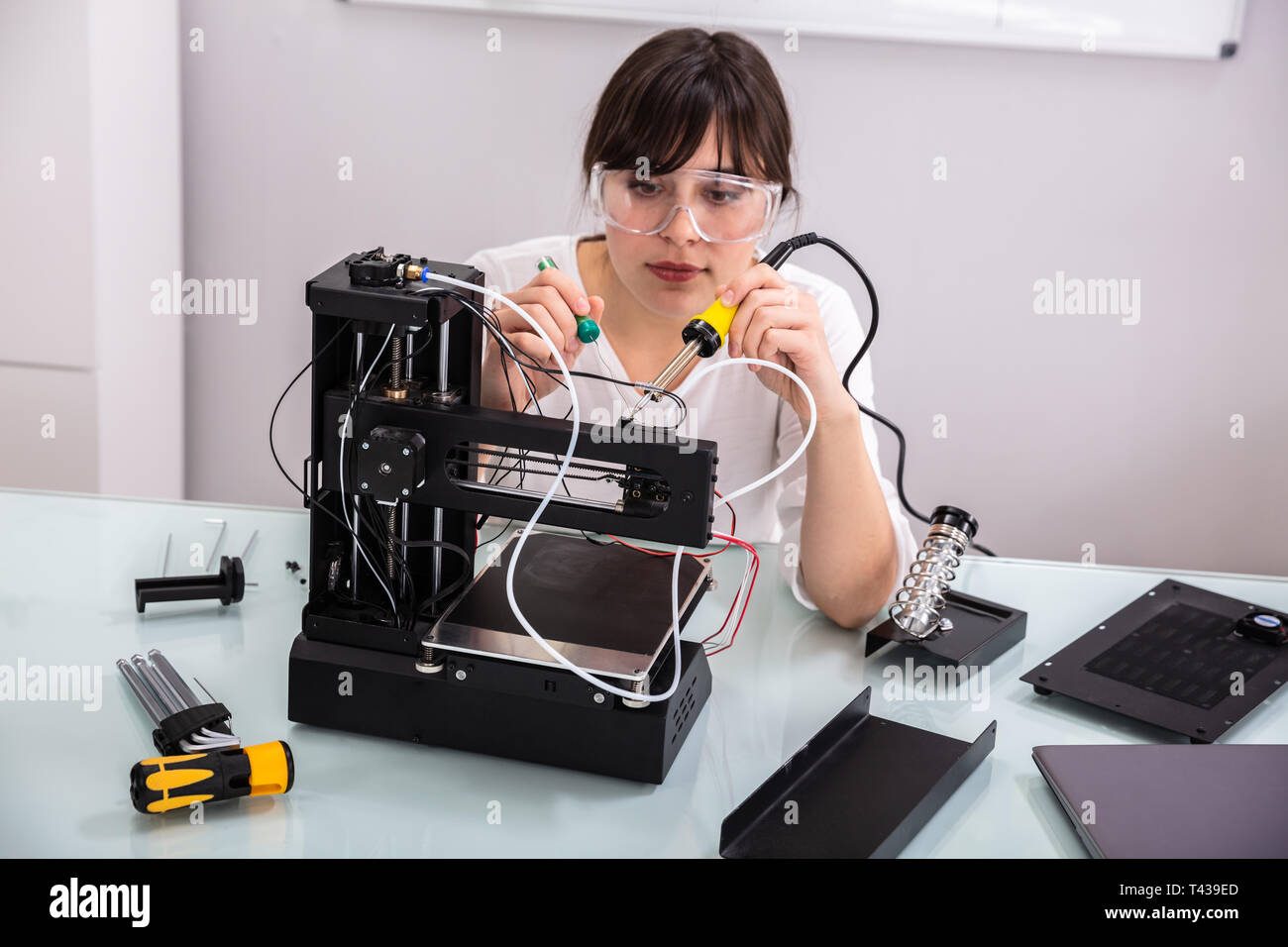 Human hand holding soldering iron hi-res stock photography and images ...