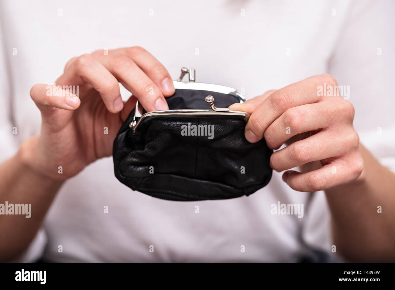 Opening purse hi-res stock photography and images - Alamy