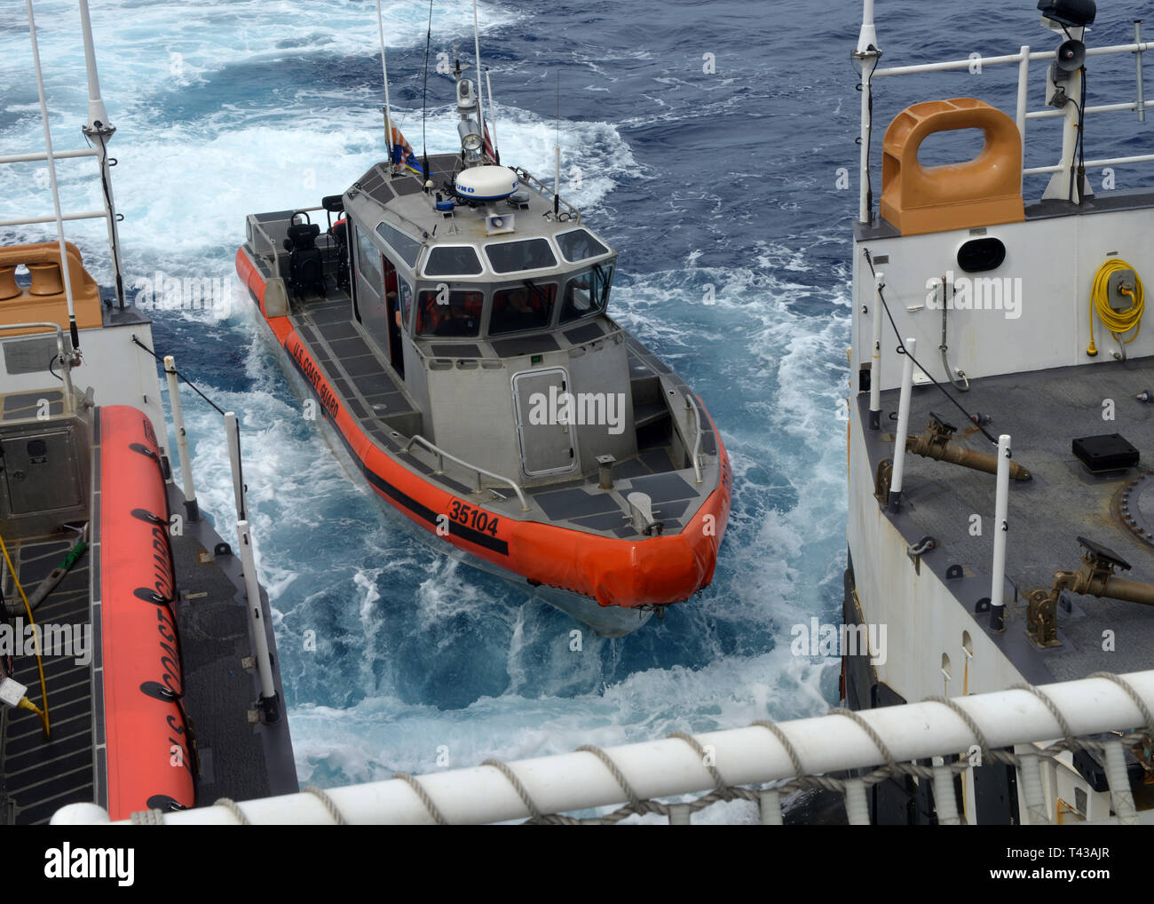Crew members from the Coast Guard Cutter Munro (WMSL 755) launch on the ...