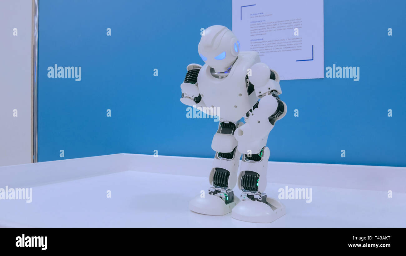 White humanoid robot dancing Stock Photo - Alamy