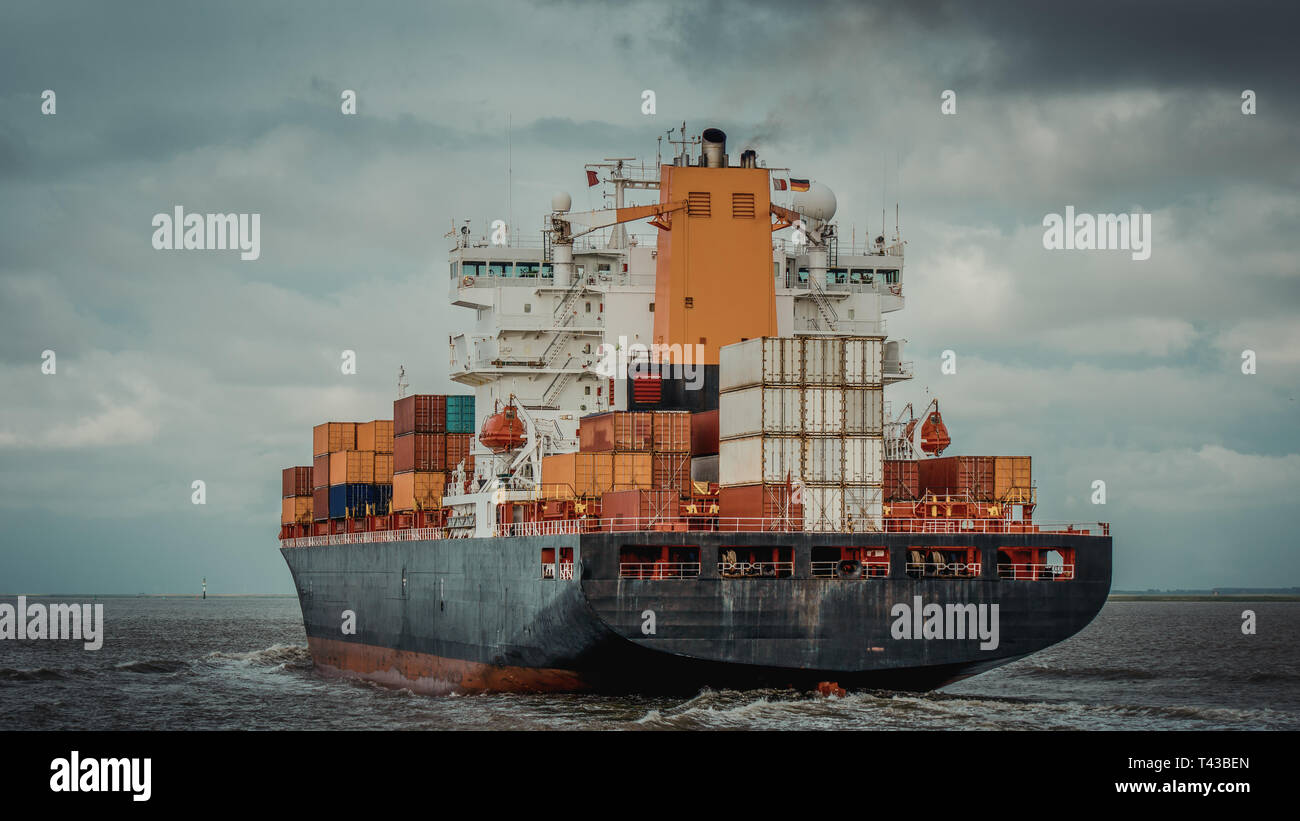 container ship on a river Stock Photo - Alamy