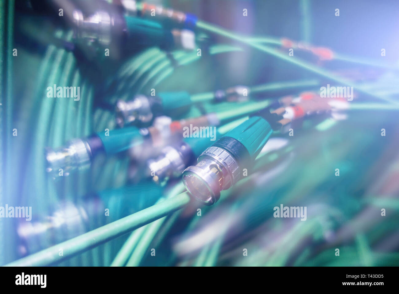 Acoustic audio cable server. Green audio cable. Many acoustic cables ...