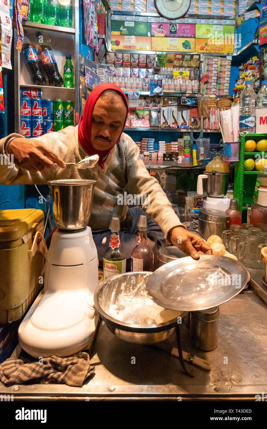 Vertical view of lassi being made at a juice stall in Kolkata aka ...