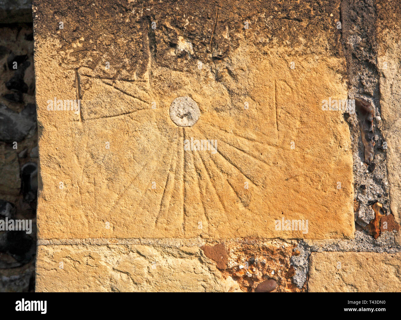 A mass dial or scratch dial on the south wall of the Church of St ...