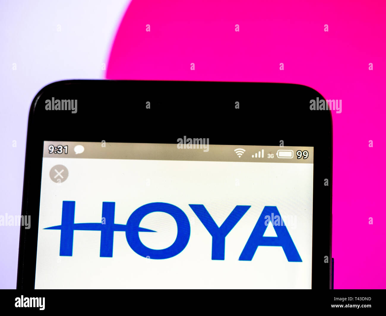 In this photo illustration a Hoya Corporation logo seen displayed on a ...
