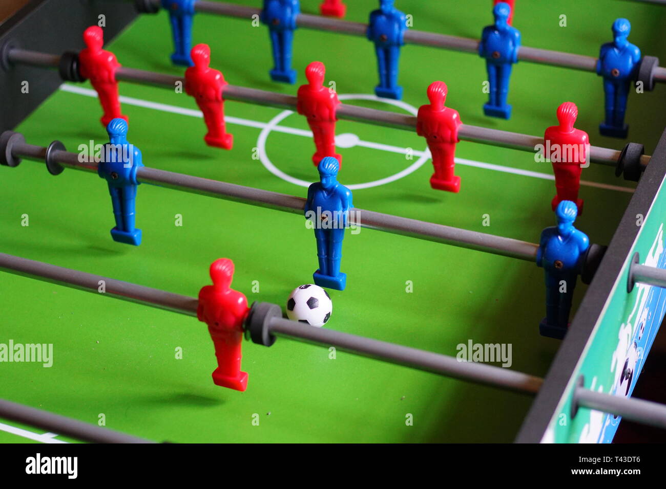 A close up of a table football game with red and blue players Stock ...
