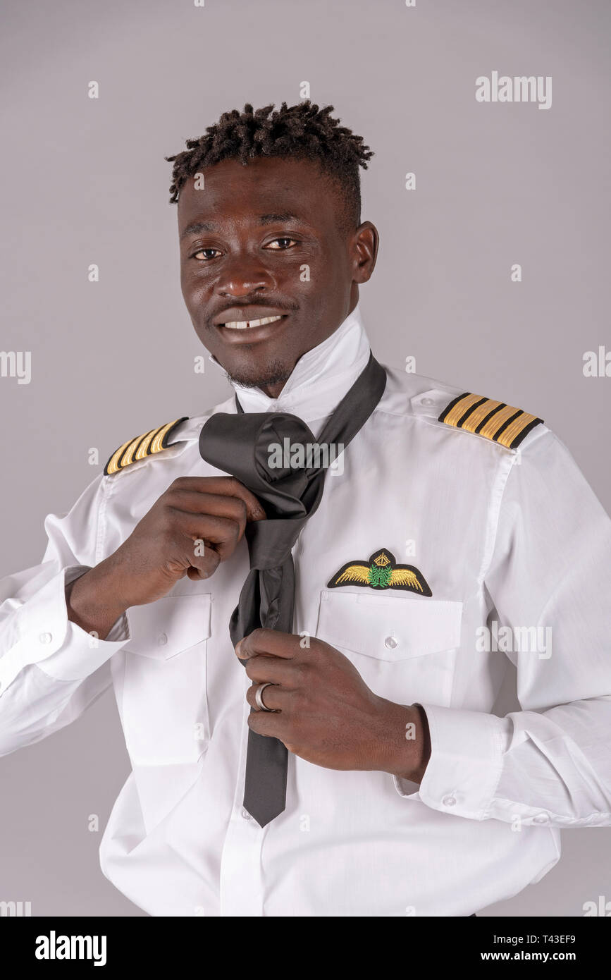 Male pilot getting dressed hi-res stock photography and images - Alamy