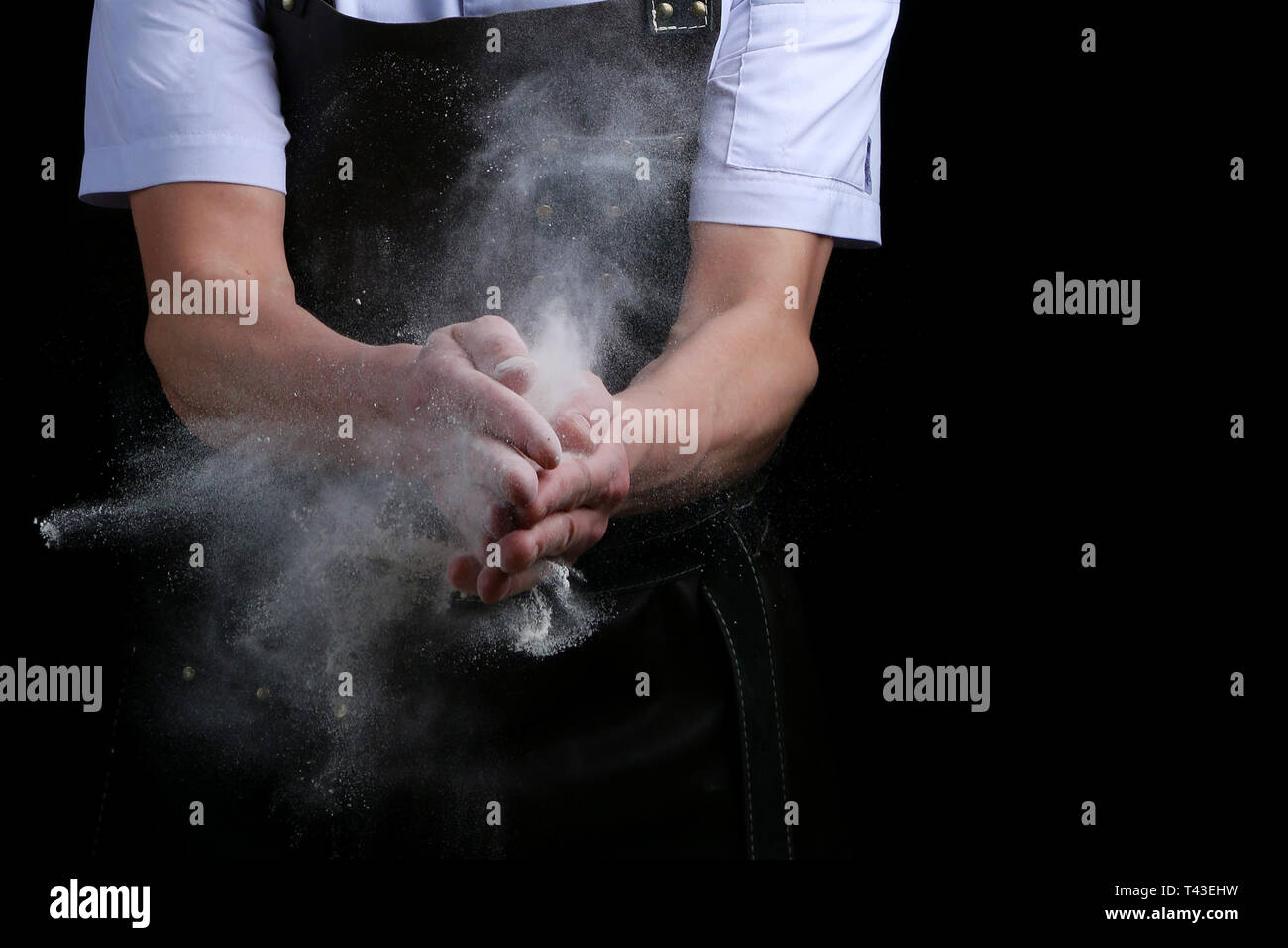 hands and flour in splash baker clap on black background Stock Photo ...