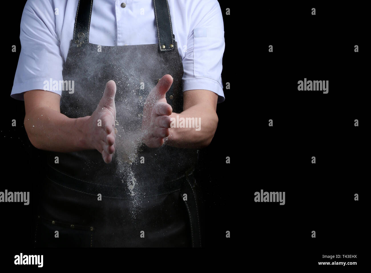 hands and flour in splash baker clap on black background Stock Photo ...