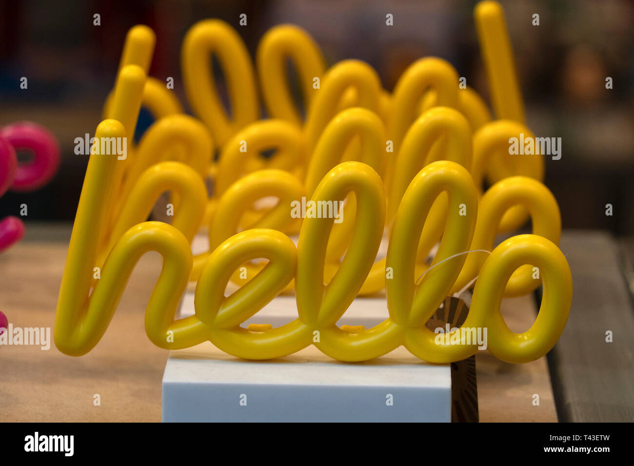 Hello neon sign yellow Stock Photo - Alamy