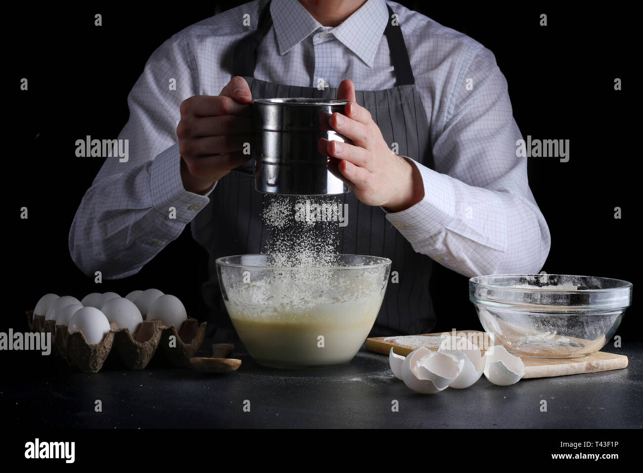 Man hands pouring flour in hi-res stock photography and images - Alamy