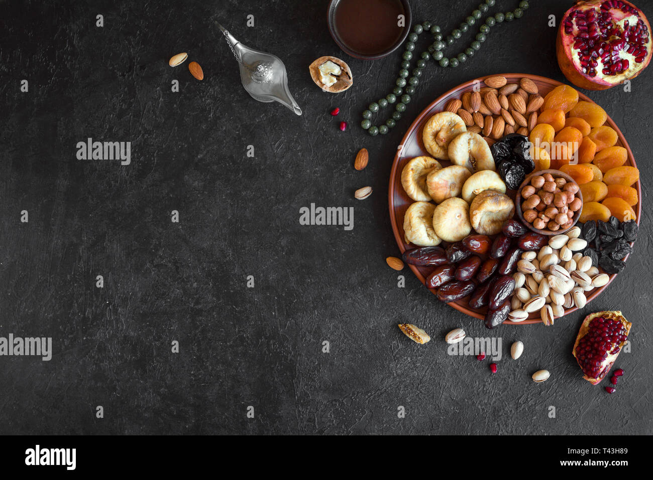 Traditional Muslim Iftar Food on black, copy space. Ramadan kareem with ...