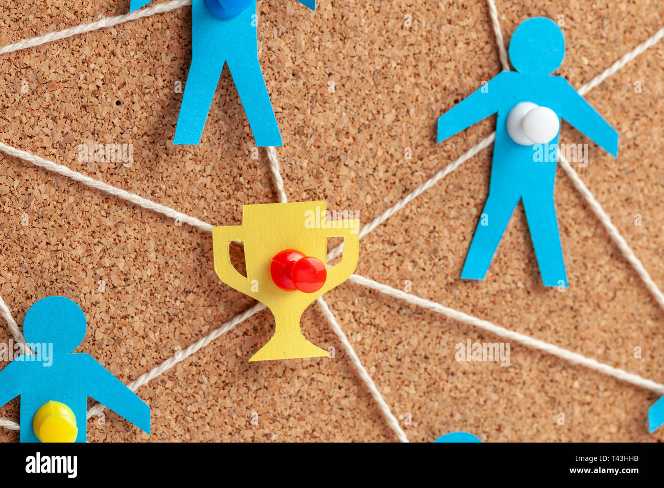 The winning cup is a symbol for achieving team goals. Cup and people ...