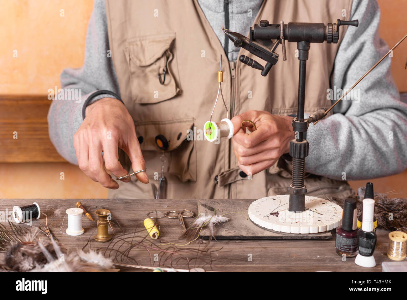 Hands tying hook hi-res stock photography and images - Alamy