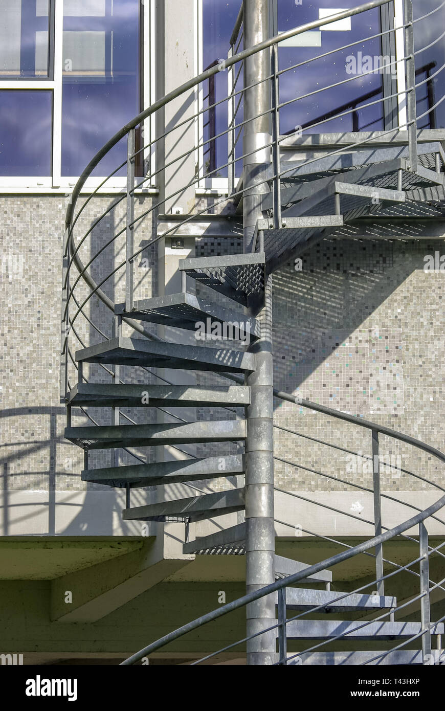 Spiral staircase at the exterior facade of a modern architecture in ...