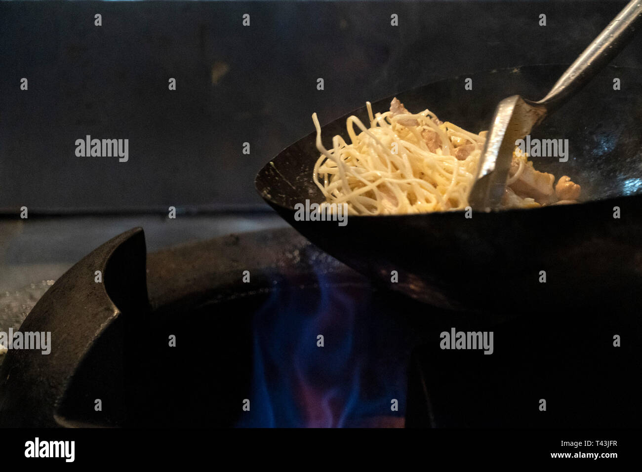 wok rice spaghetti while cooking Stock Photo - Alamy
