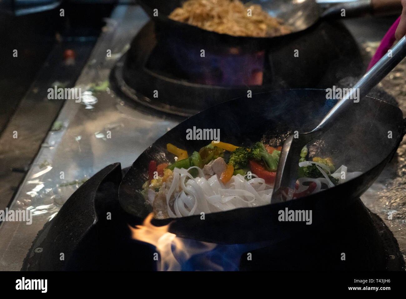 wok rice spaghetti while cooking Stock Photo - Alamy