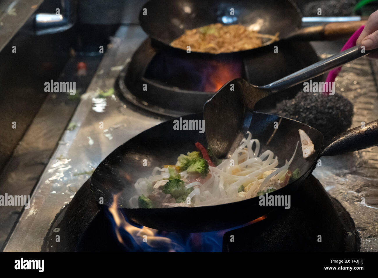 wok rice spaghetti while cooking Stock Photo - Alamy