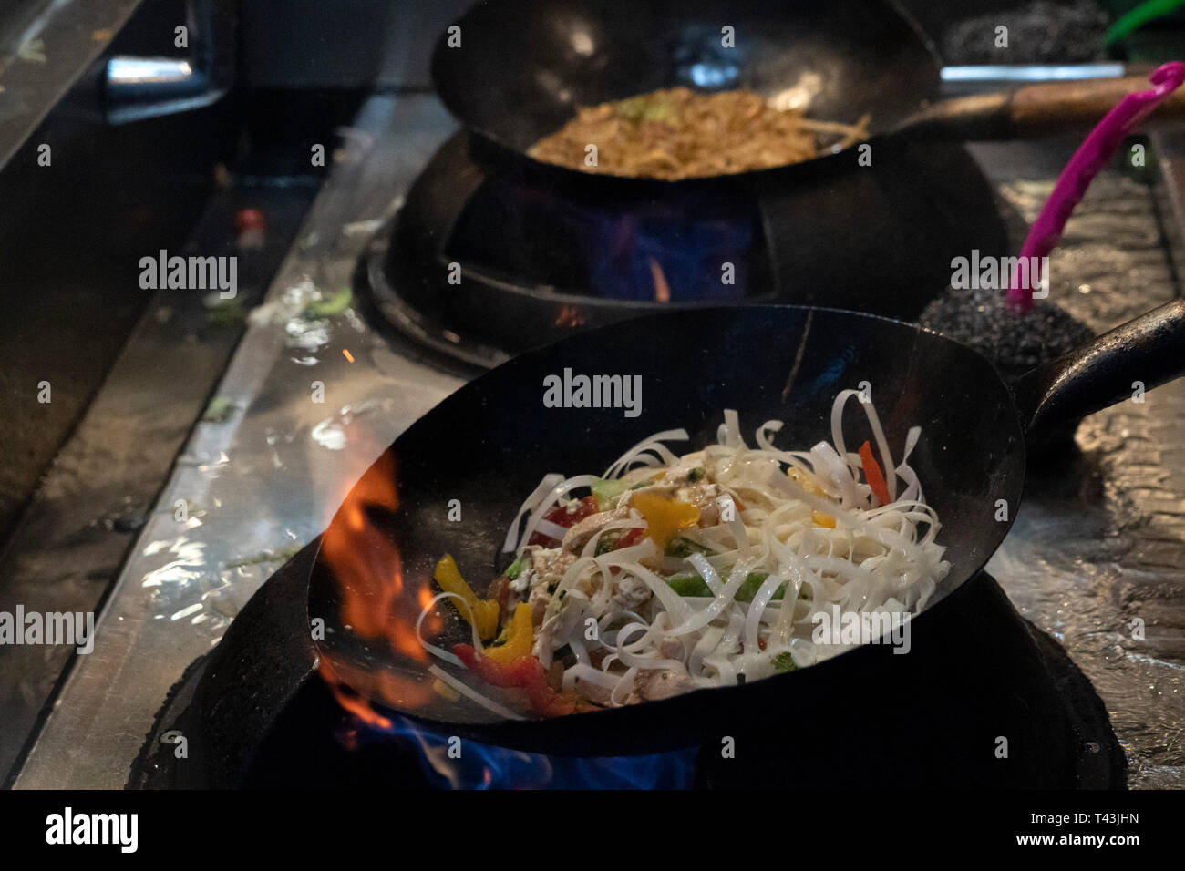 wok rice spaghetti while cooking Stock Photo - Alamy