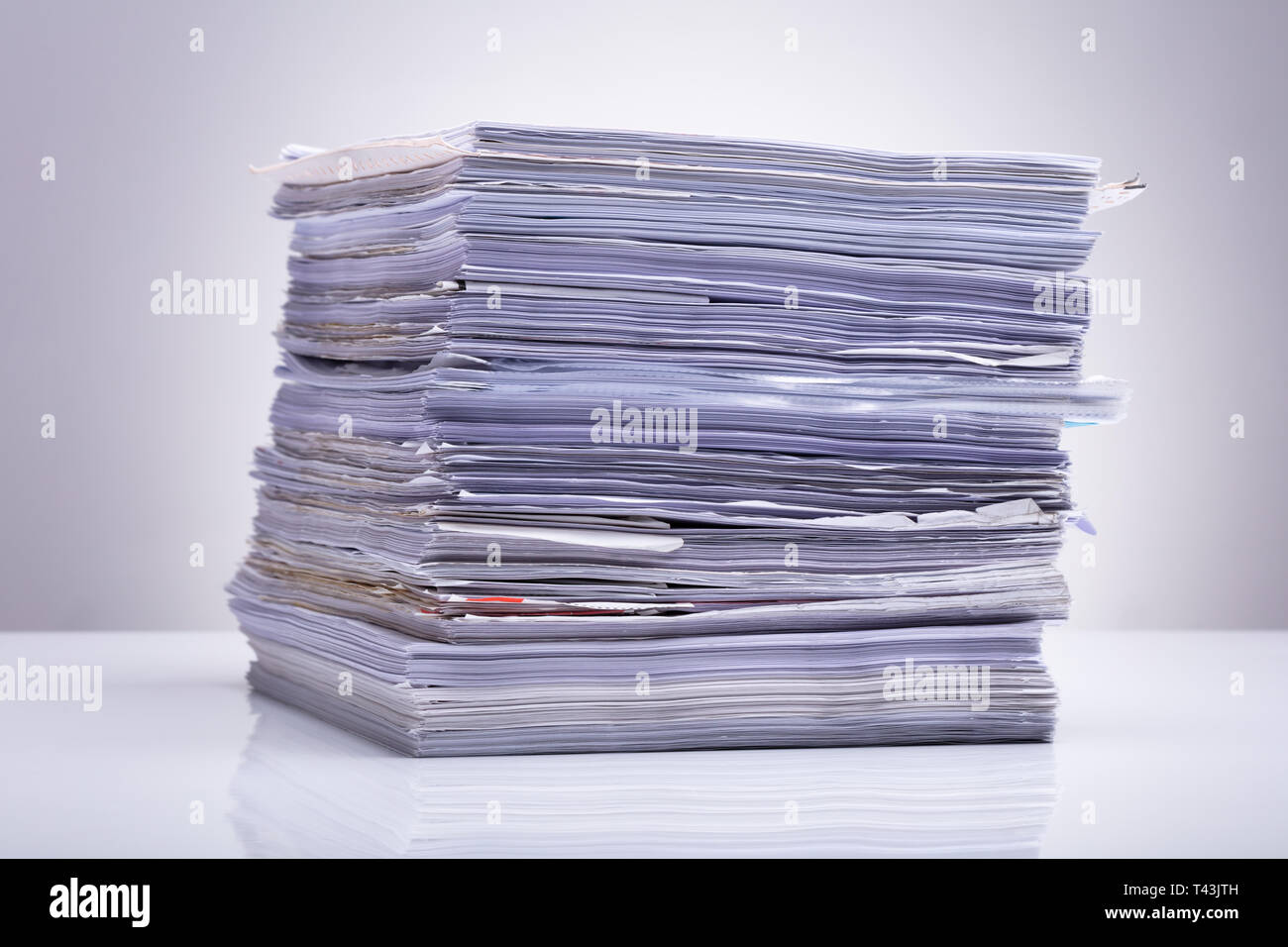 Photo Of Stacked Document Paper On Reflecting Backdrop Stock Photo - Alamy
