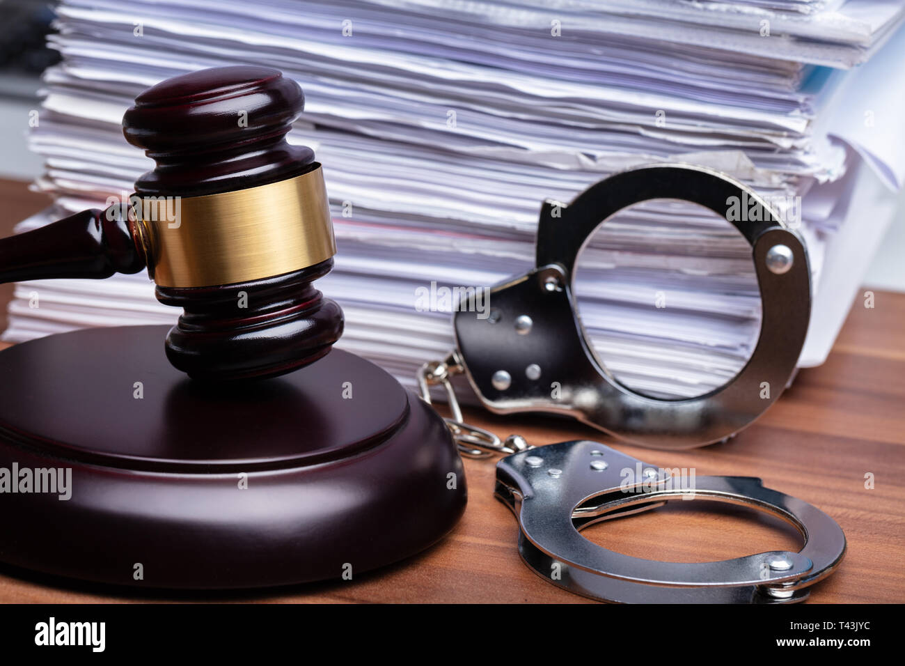 Judge gavel handcuffs on documents hi-res stock photography and images ...