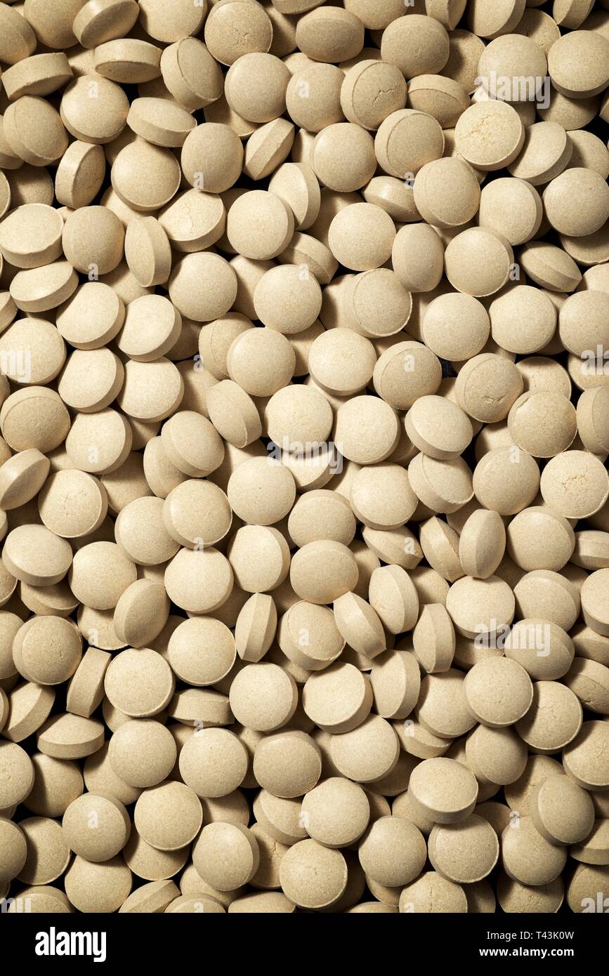Many beer yeast pills on a table Stock Photo - Alamy