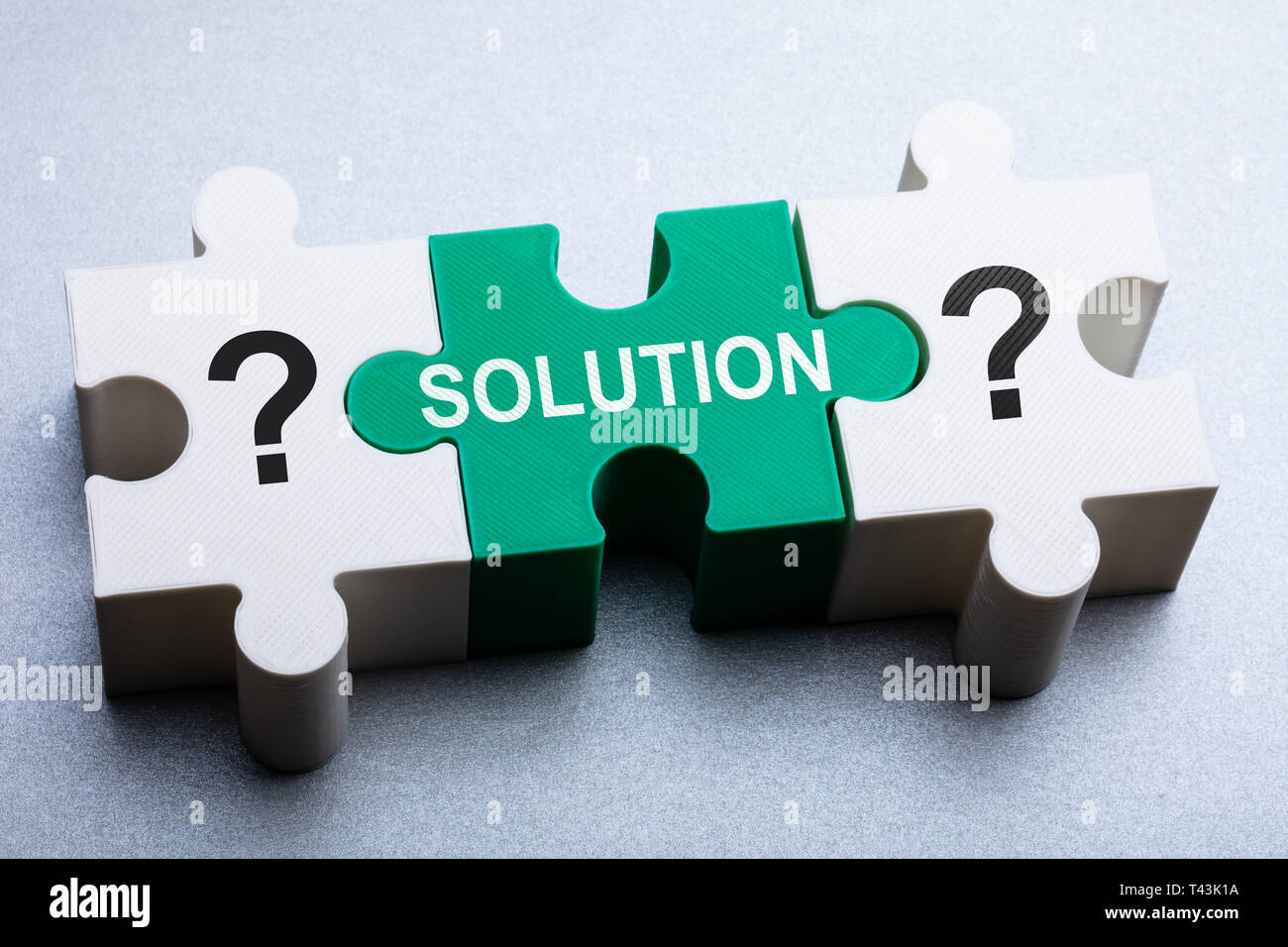 An Elevated View Of Solution Word Made With Puzzle Over Grey Background ...