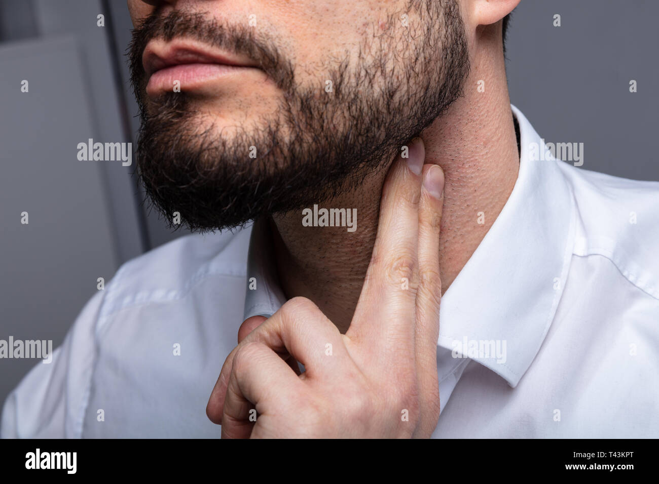 Hand touching neck hi-res stock photography and images - Alamy
