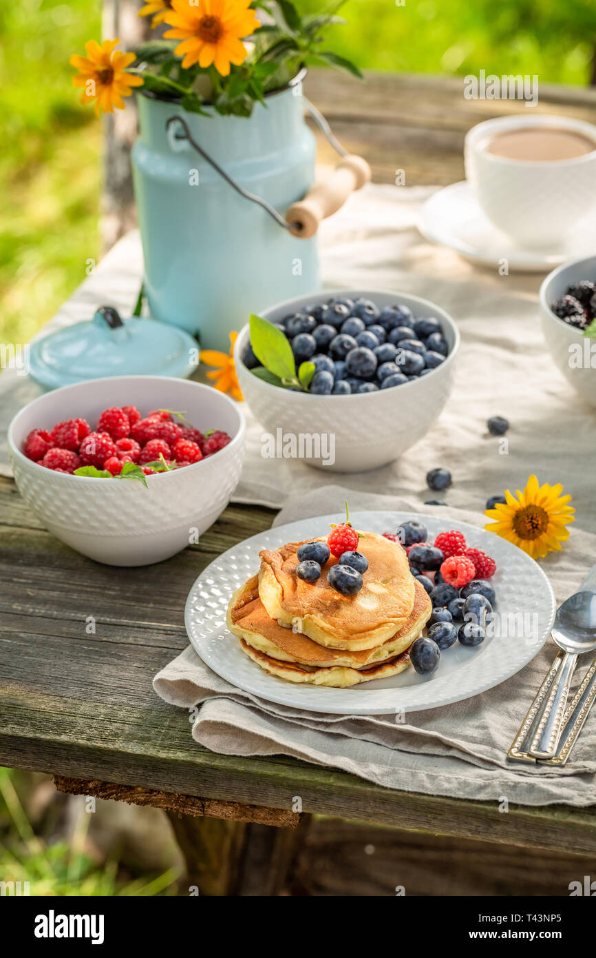 Tasty pancakes in the garden for breakfast Stock Photo - Alamy