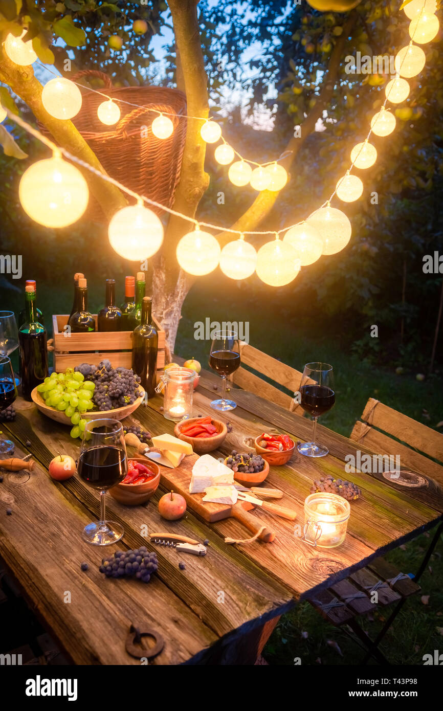 Preparation for supper with wine and fruits in the evening Stock Photo ...