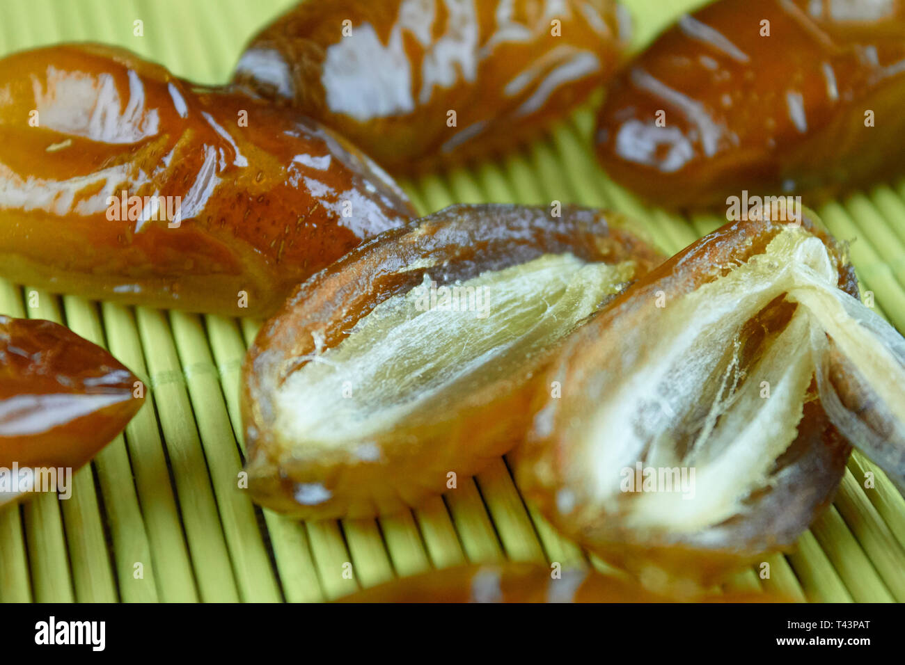 sweet algerian arabic split dates fruits open on a wooden ground Stock ...