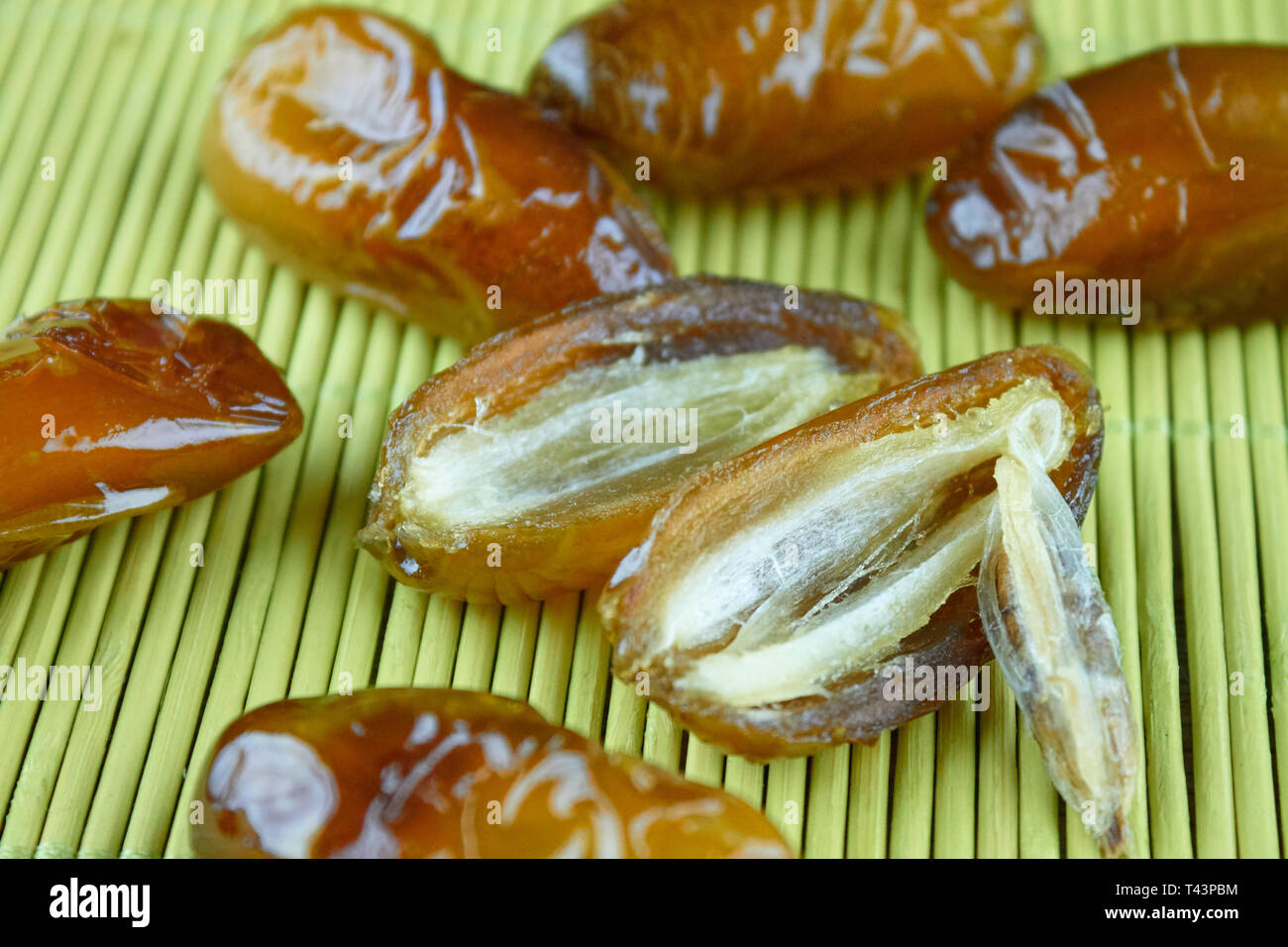 sweet algerian arabic split dates fruits open on a wooden ground Stock ...