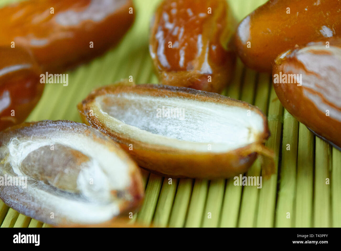 sweet algerian arabic split dates fruits open on a wooden ground Stock ...