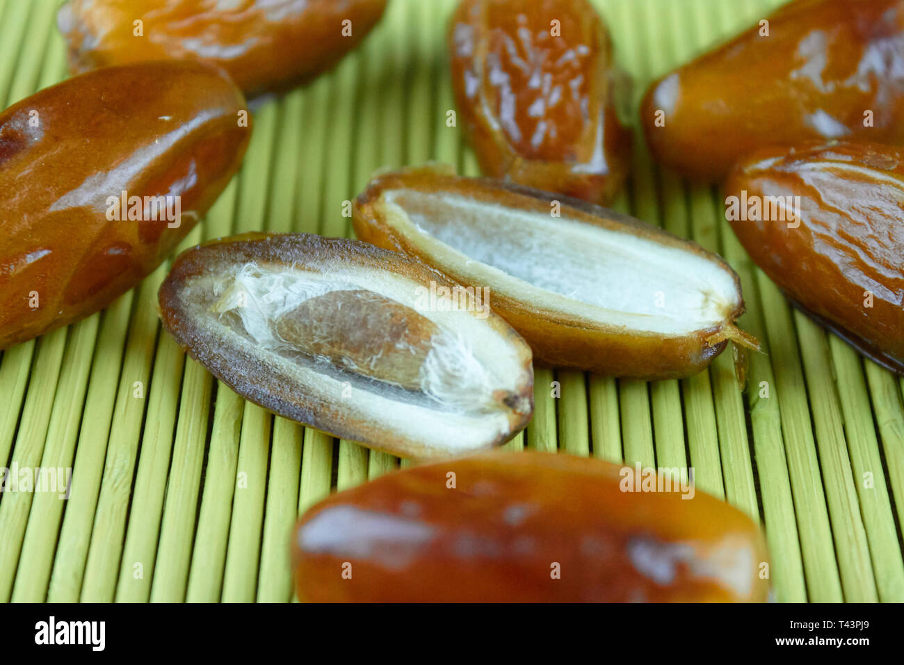 sweet algerian arabic split dates fruits open on a wooden ground Stock ...