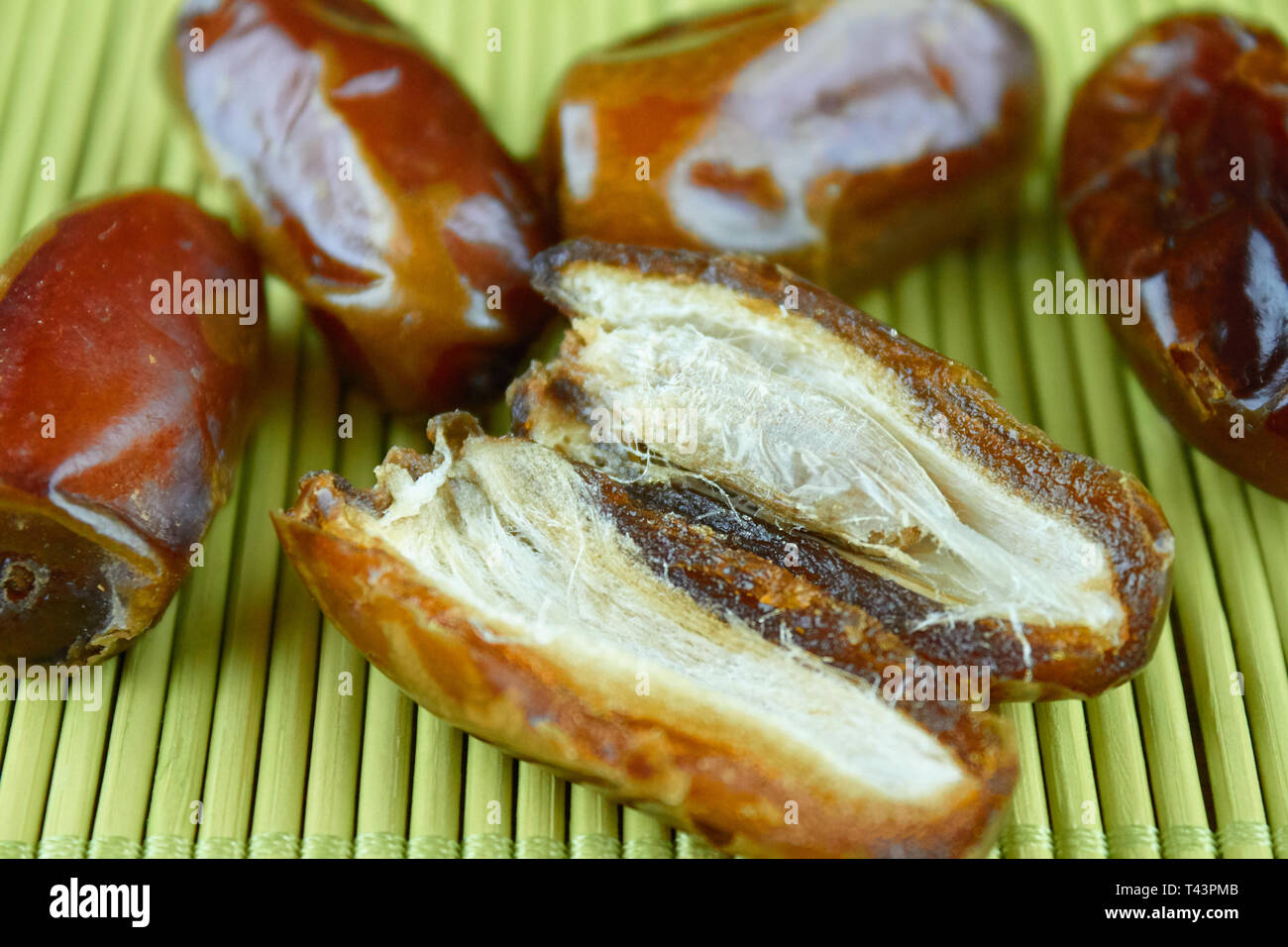 sweet algerian arabic split dates fruits open on a wooden ground Stock ...