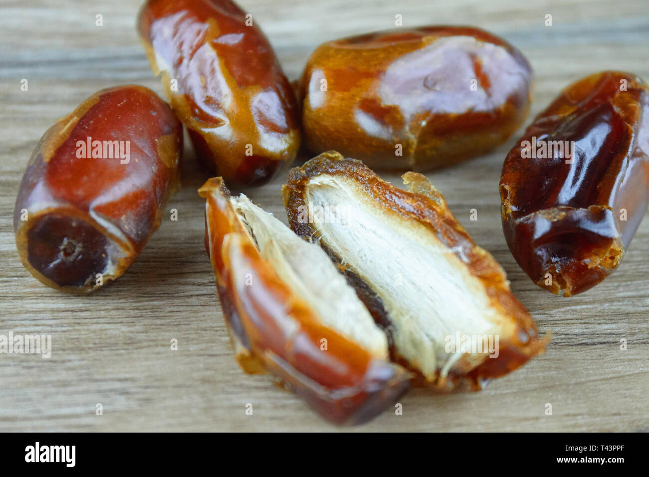 sweet algerian arabic split dates fruits open on a wooden ground Stock ...
