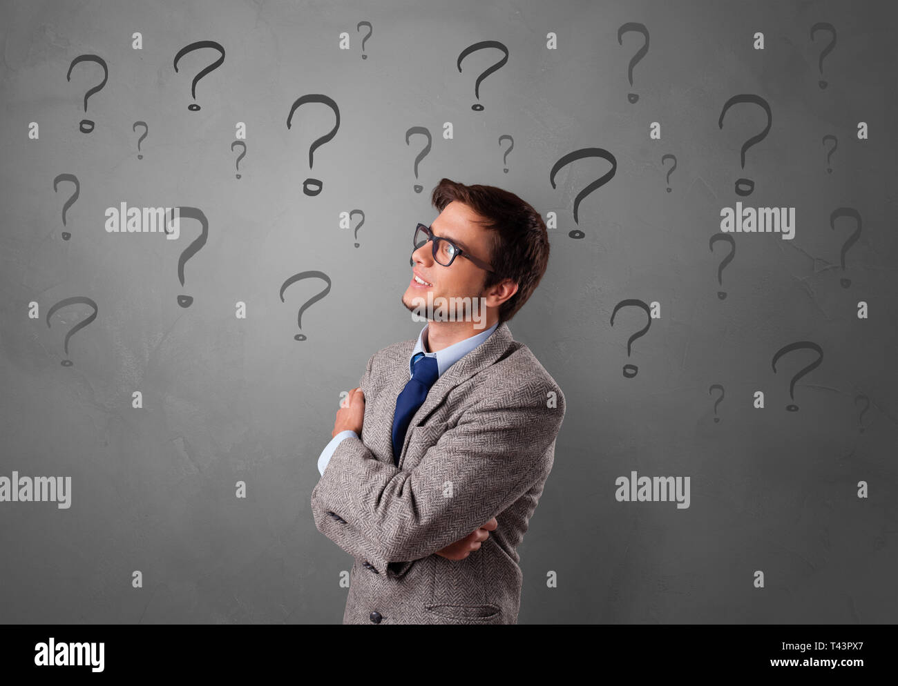 Person with question marks around face Stock Photo - Alamy