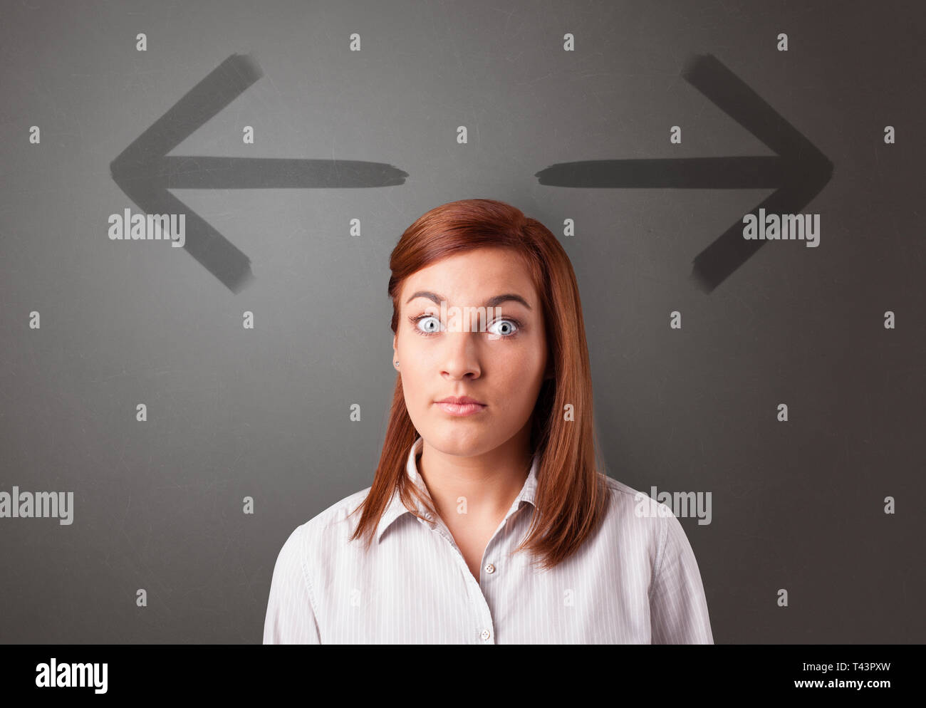 Business person choosing between two directions Stock Photo - Alamy