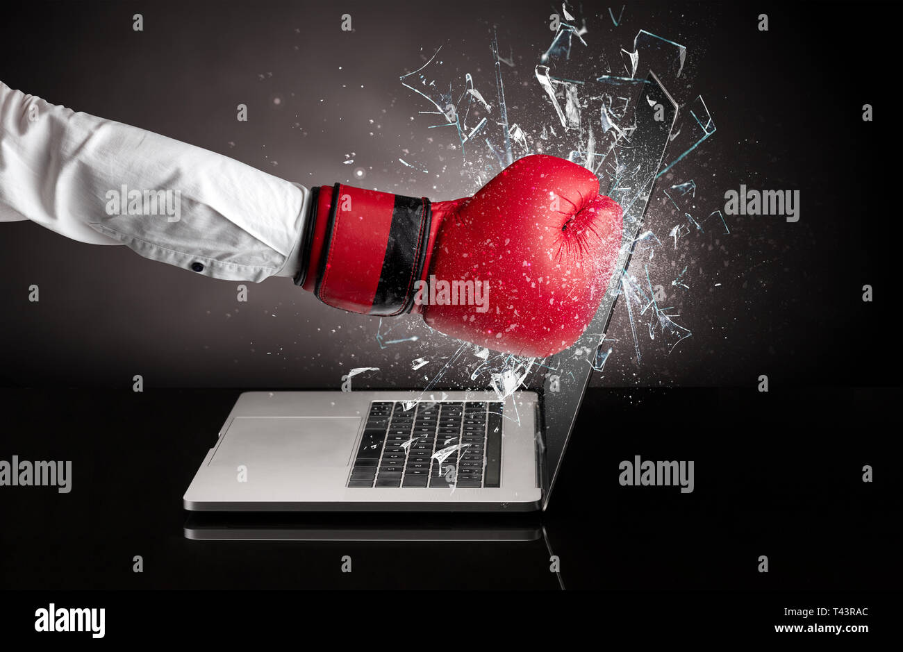 Hand hitting strongly laptop screen glass Stock Photo - Alamy