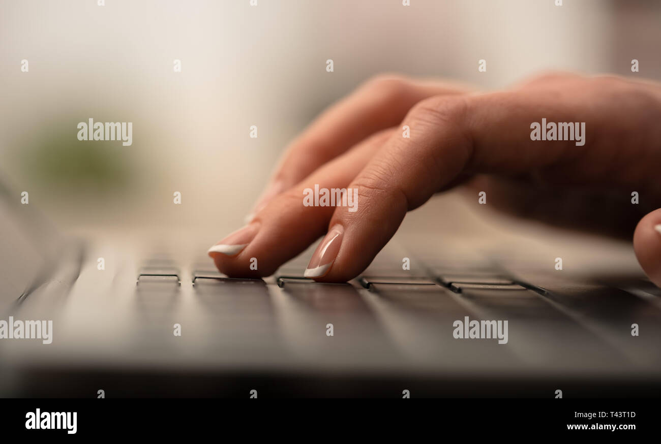 Hand typing on keyboard with office concept Stock Photo - Alamy
