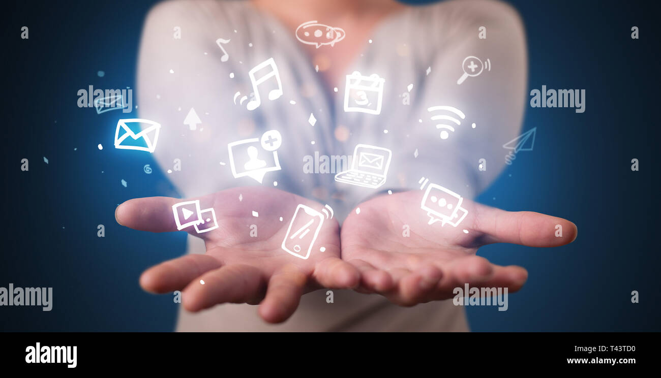 Hand holding application icons and symbols in her hand Stock Photo - Alamy