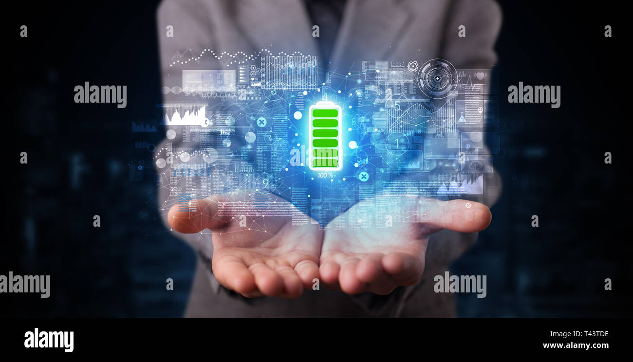 Elegant hand holding battery with full of energy Stock Photo - Alamy