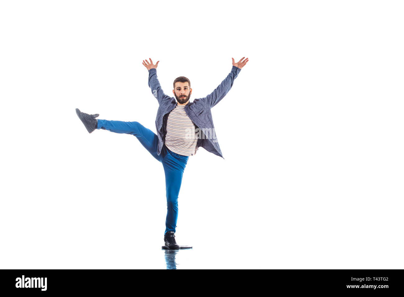 Male dancer is doing modern dance on white background Stock Photo - Alamy