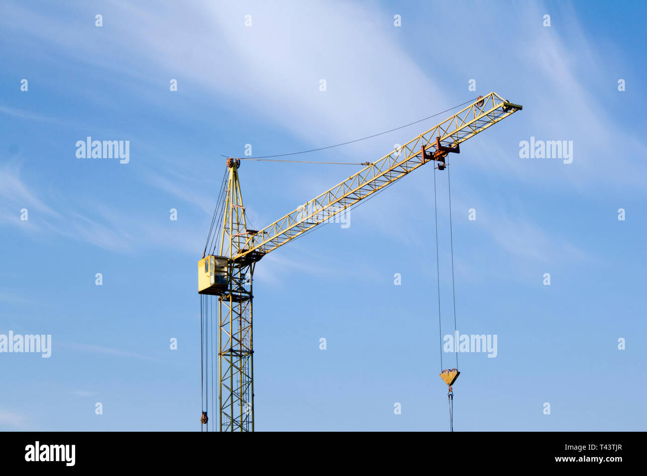Elevating crane on a building area Stock Photo - Alamy